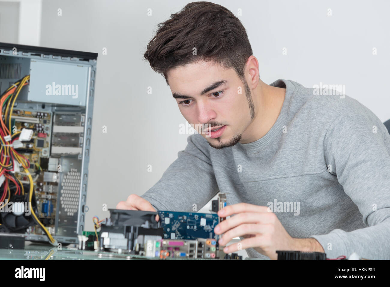 young handsome computer repairer concentrated on his work Stock Photo ...