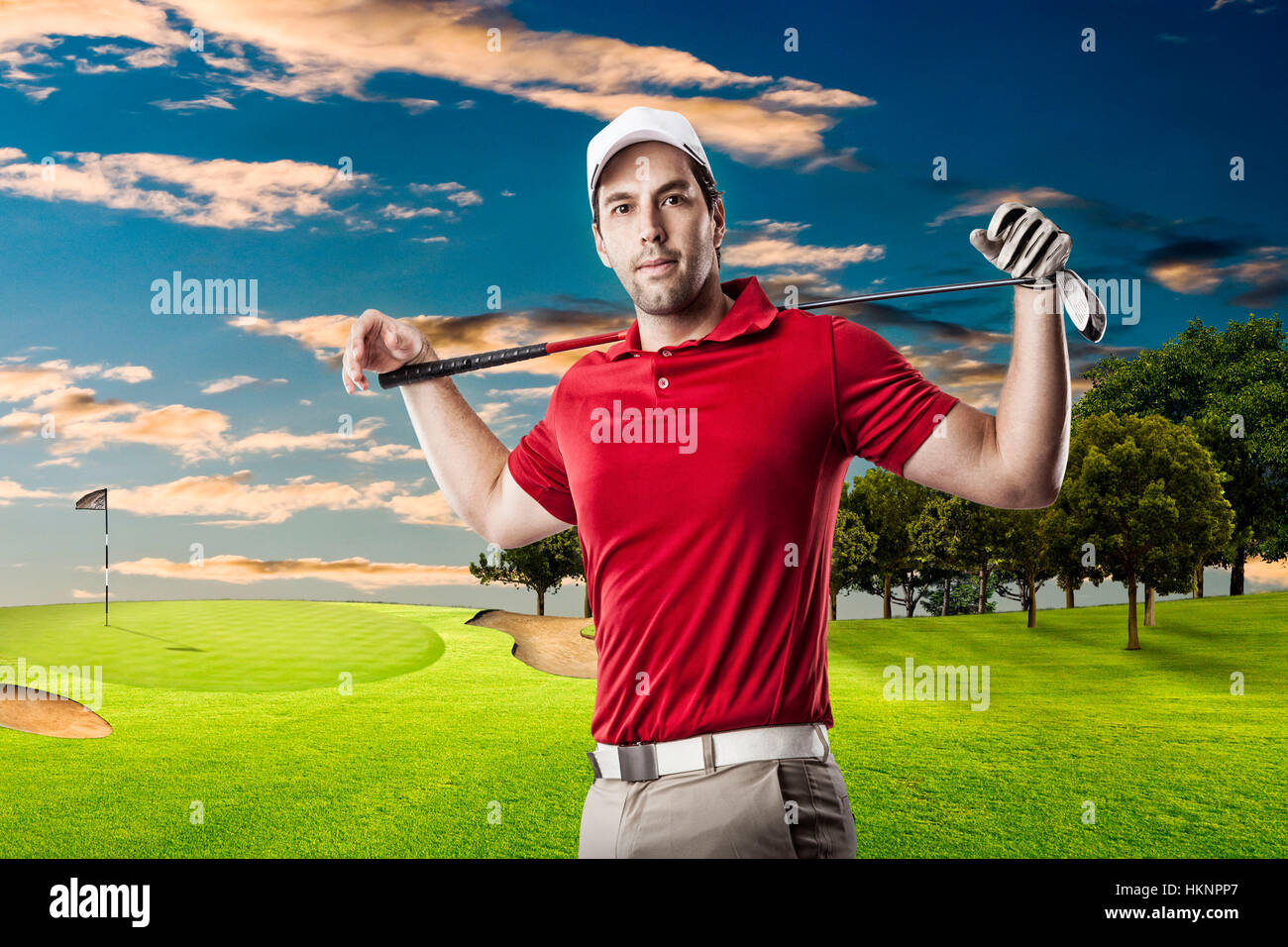 Golf Player in a red shirt, on a golf course Stock Photo - Alamy