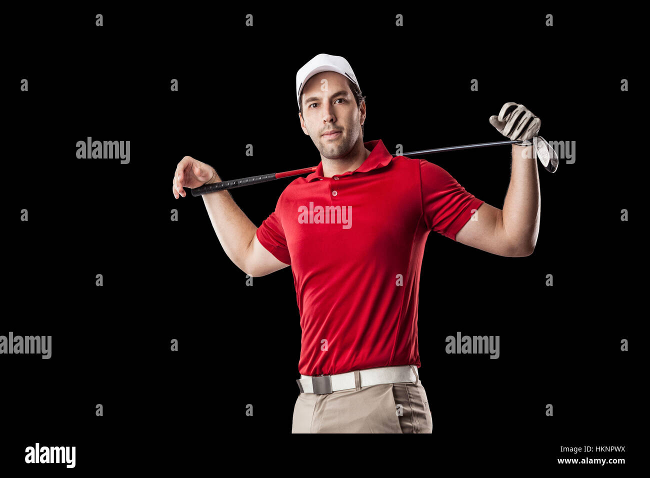 Golf Player in a red shirt, on a black Background Stock Photo - Alamy