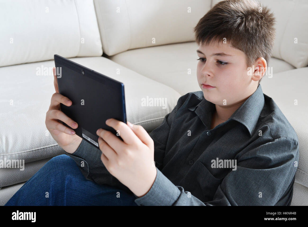 Teen boy tablet home hi-res stock photography and images - Alamy