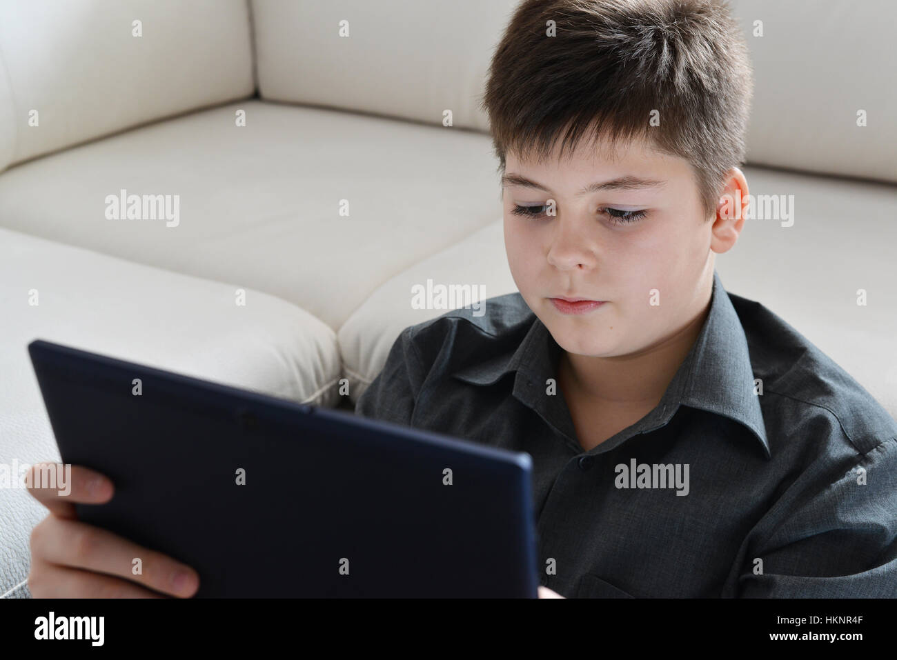 Teen boy tablet home hi-res stock photography and images - Alamy