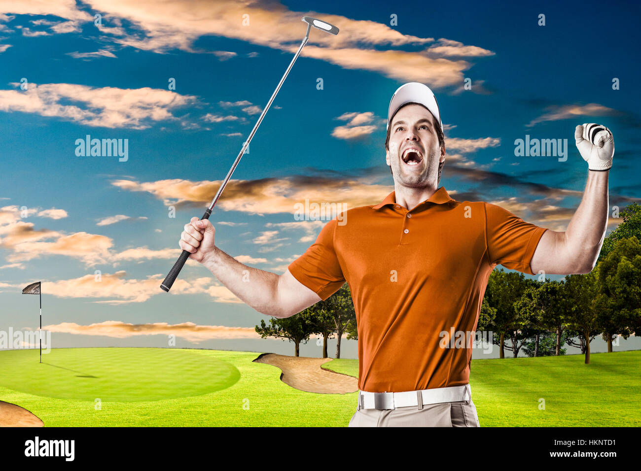 Golf Player in a orange shirt celebrating, on a golf course Stock Photo ...