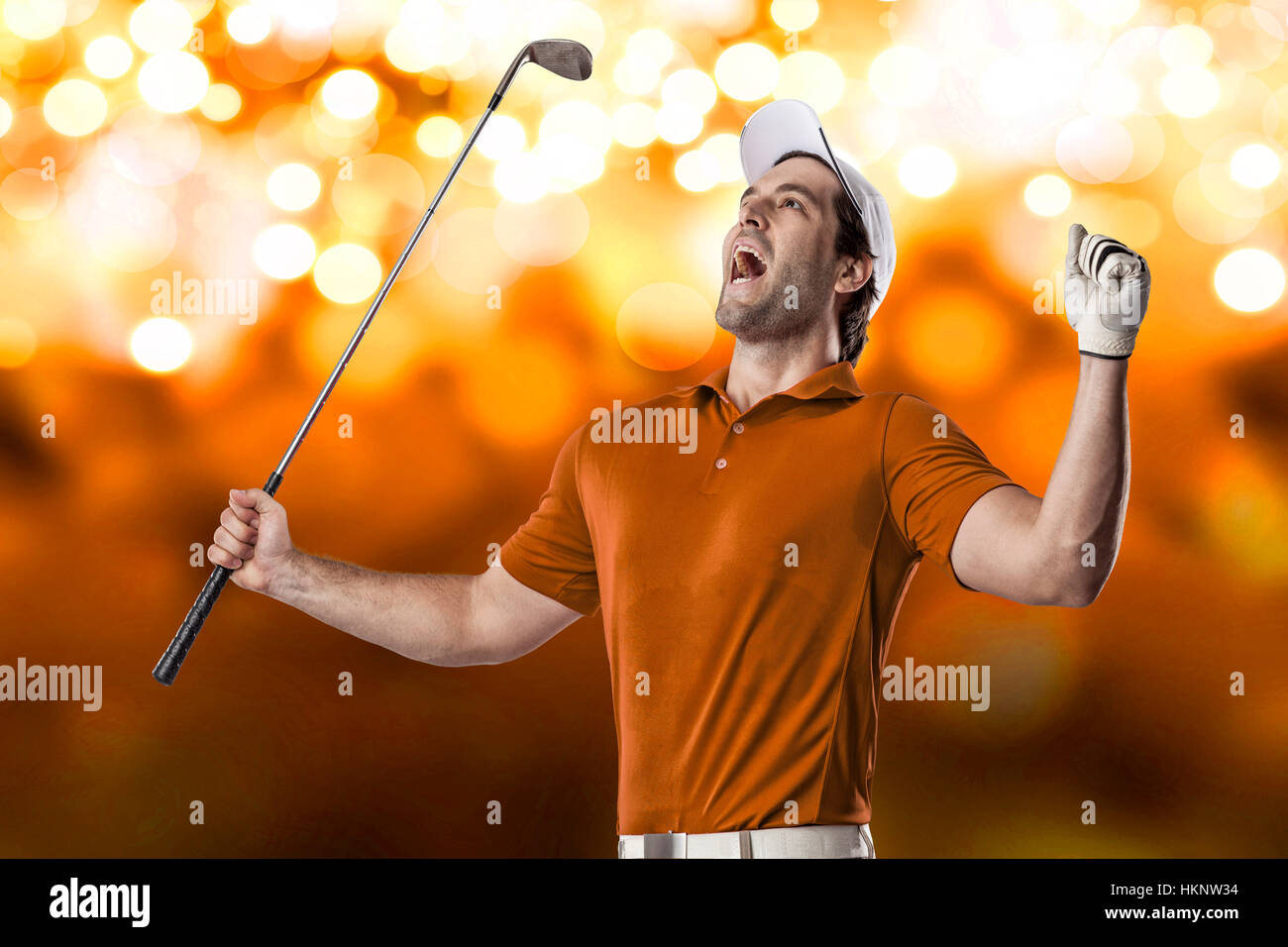 Golf Player in a orange shirt celebrating, on a orange lights ...