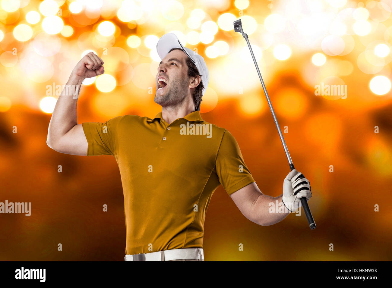Golf Player in a orange shirt celebrating, on a orange lights ...