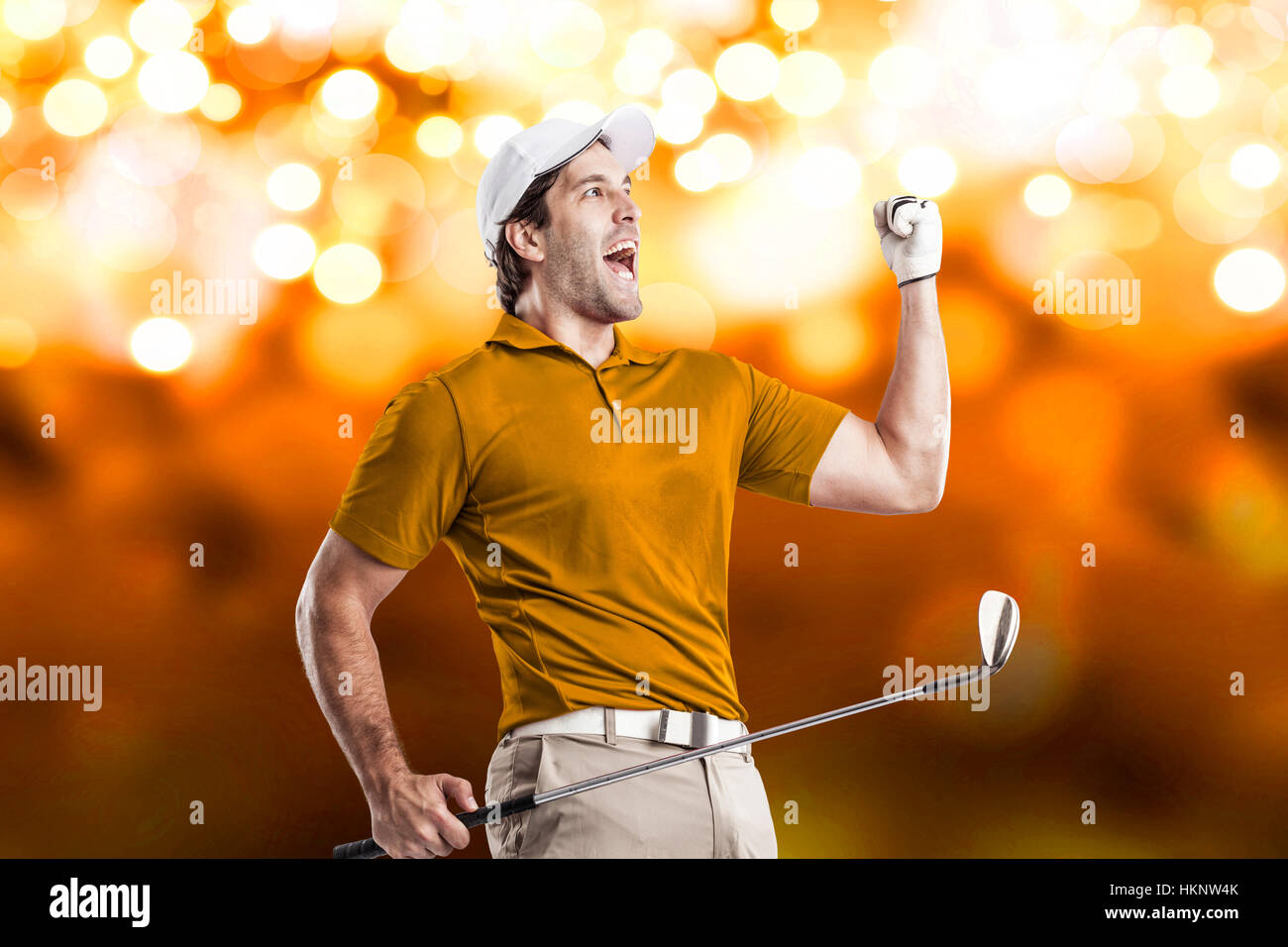 Golf Player in a orange shirt celebrating, on a orange lights ...