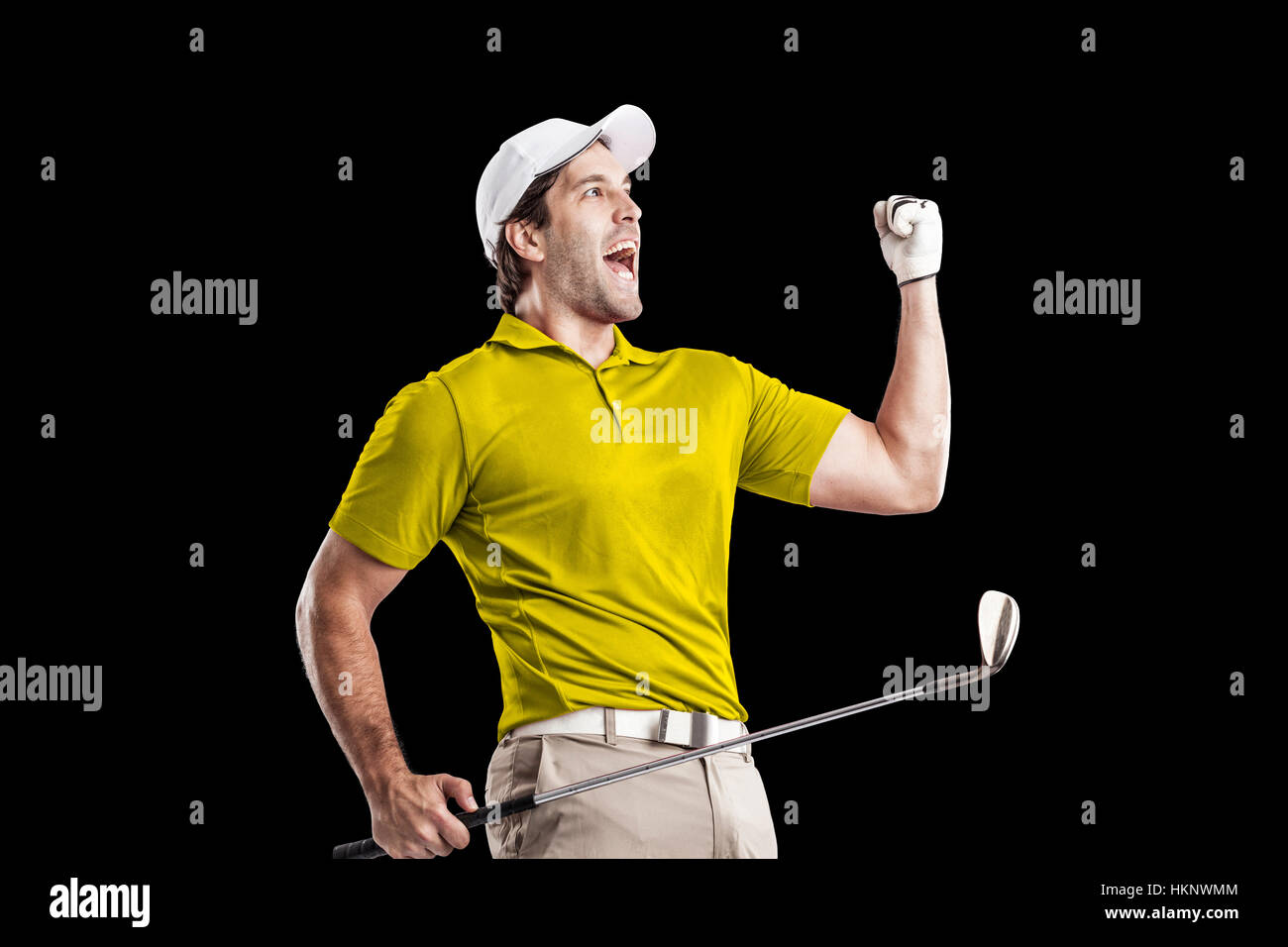 Golf Player in a yellow shirt celebrating, on a Black Background Stock ...