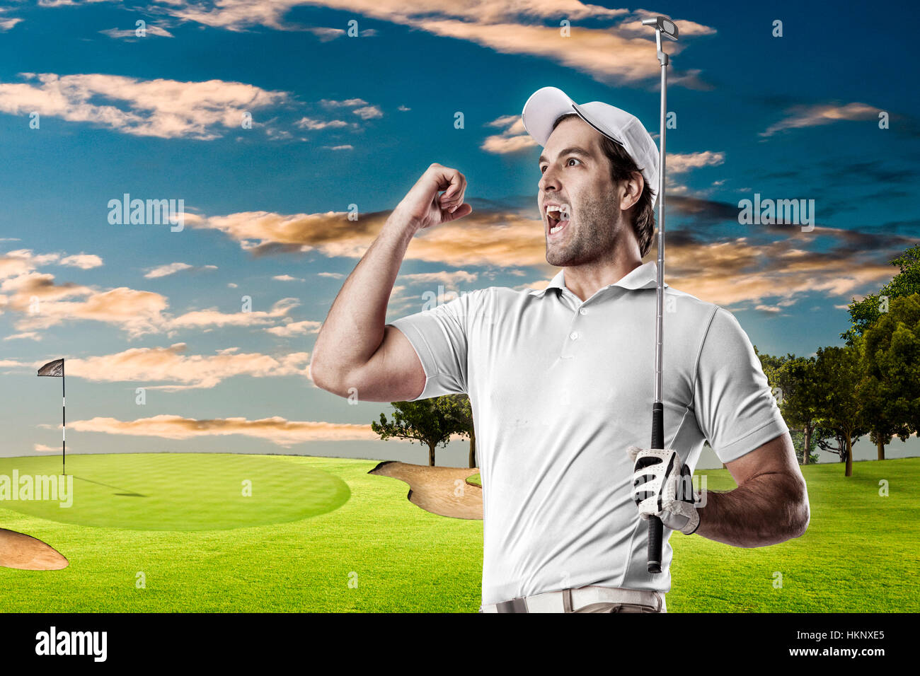 Golf Player in a white shirt celebrating, on a golf course Stock Photo ...