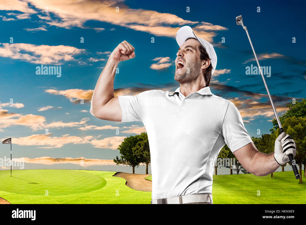 Golf Player in a white shirt celebrating, on a golf course Stock Photo ...