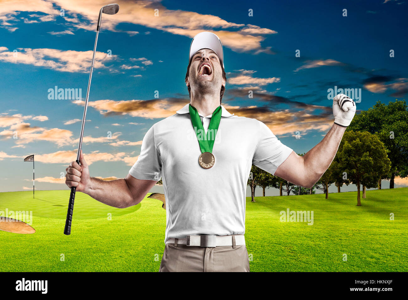 Golf Player in a white shirt celebrating with a golden medal, on a golf ...