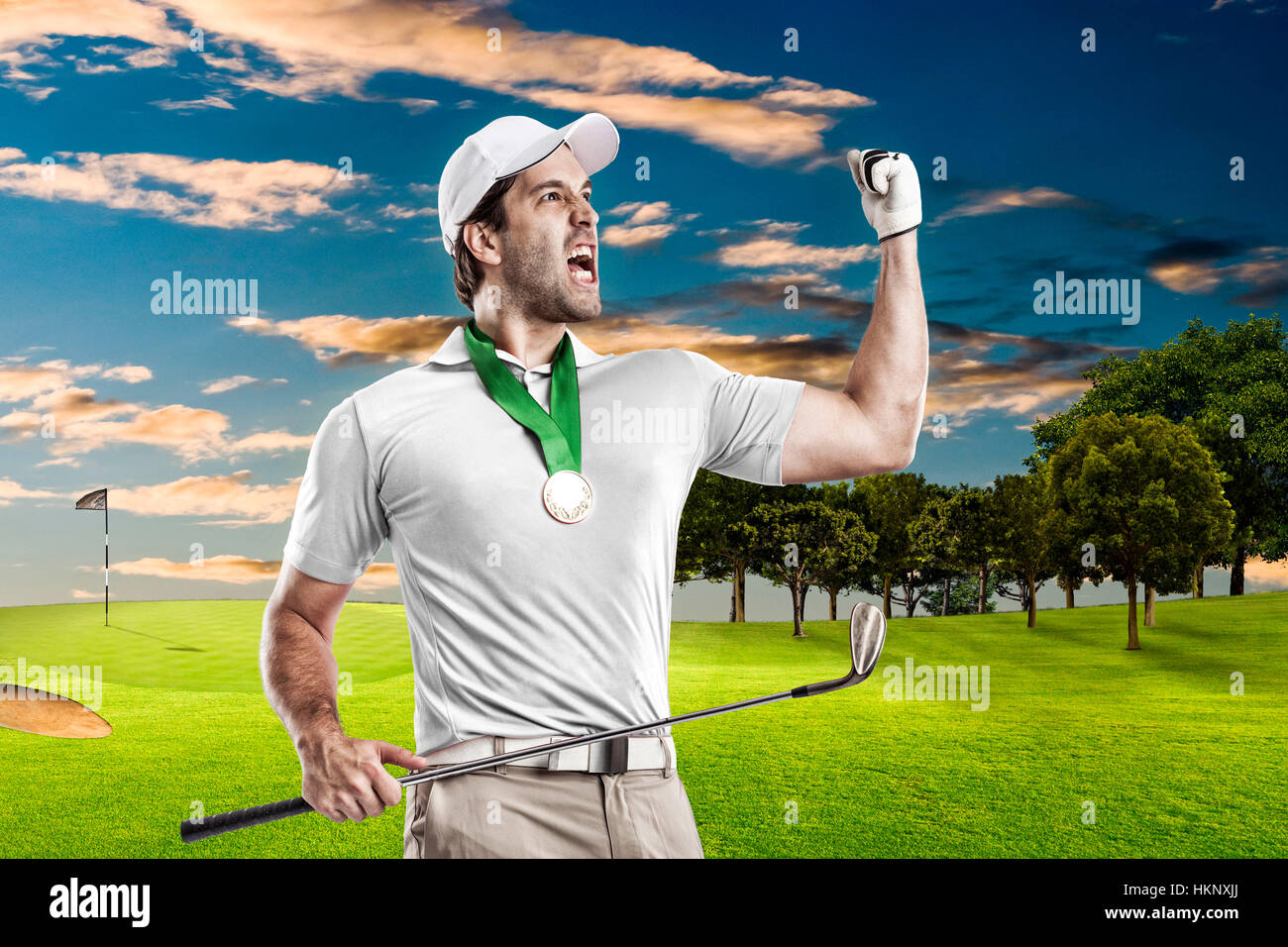 Golf Player in a white shirt celebrating with a golden medal, on a golf ...