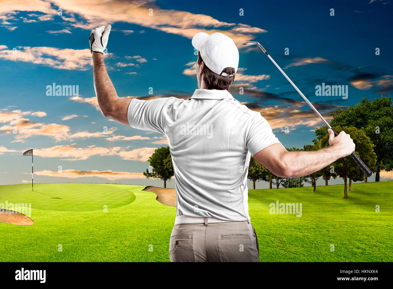 Golf Player in a white shirt celebrating, on a golf course Stock Photo ...