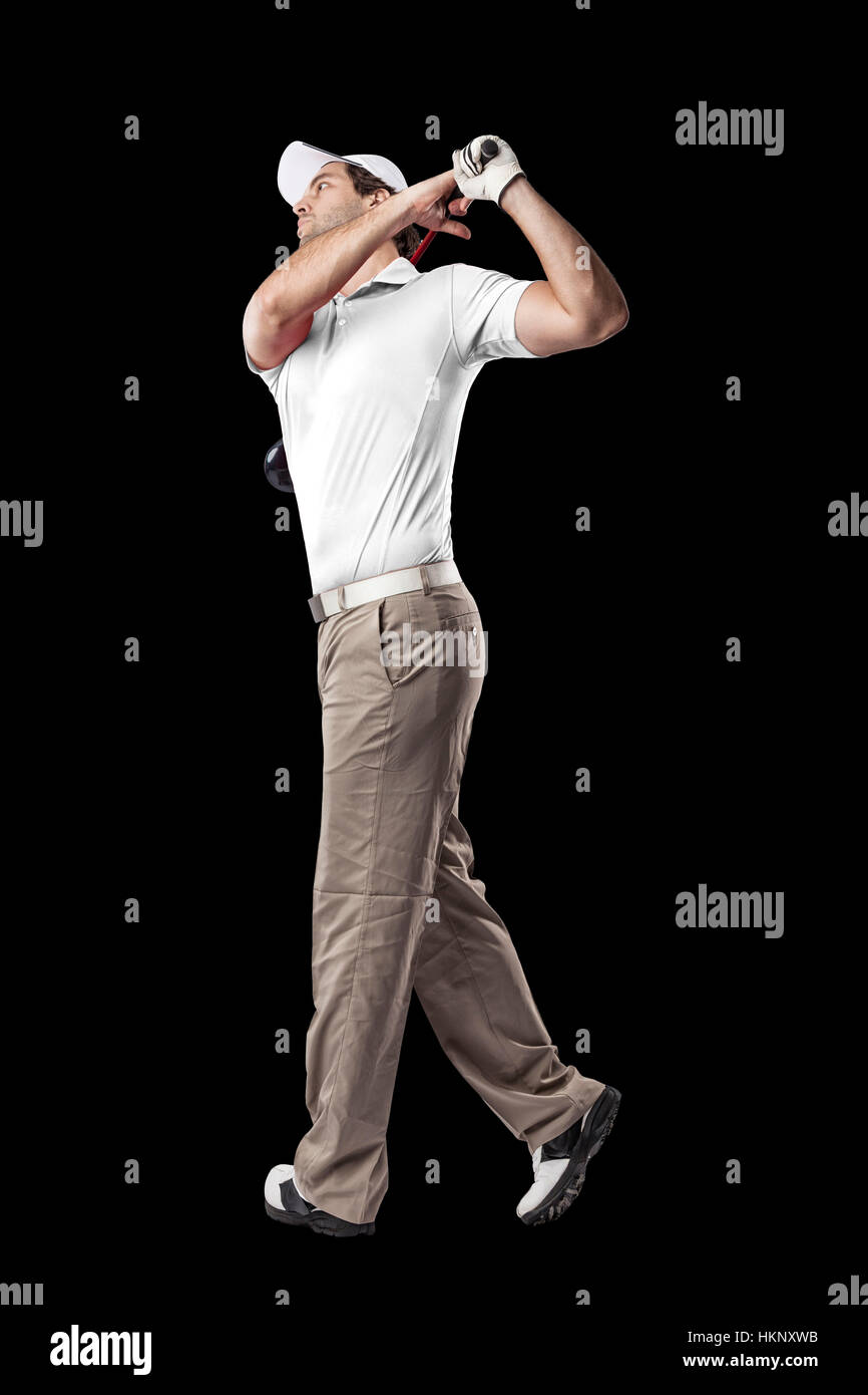 Golf Player in a white shirt taking a swing, on a black Background ...