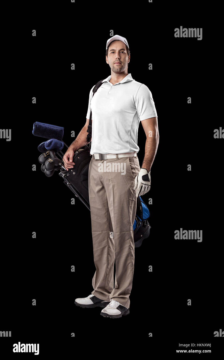Golf Player in a white shirt, standing with a bag of golf clubs on his ...
