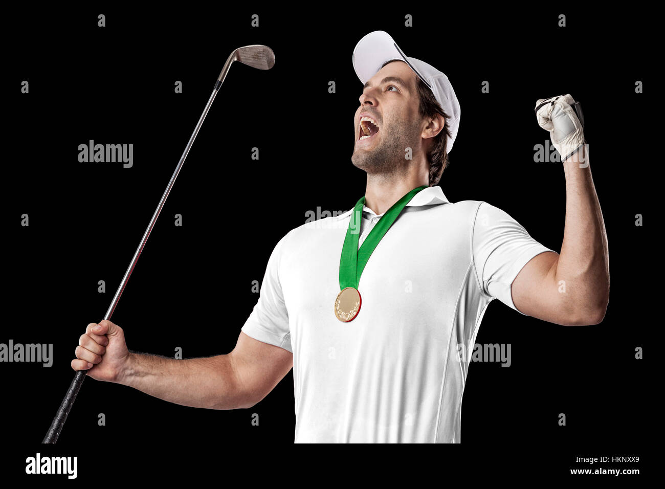Golf Player in a white shirt celebrating with a golden medal, on a ...