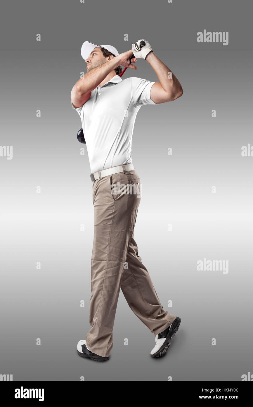 Golf Player in a white shirt taking a swing, on a white Background ...
