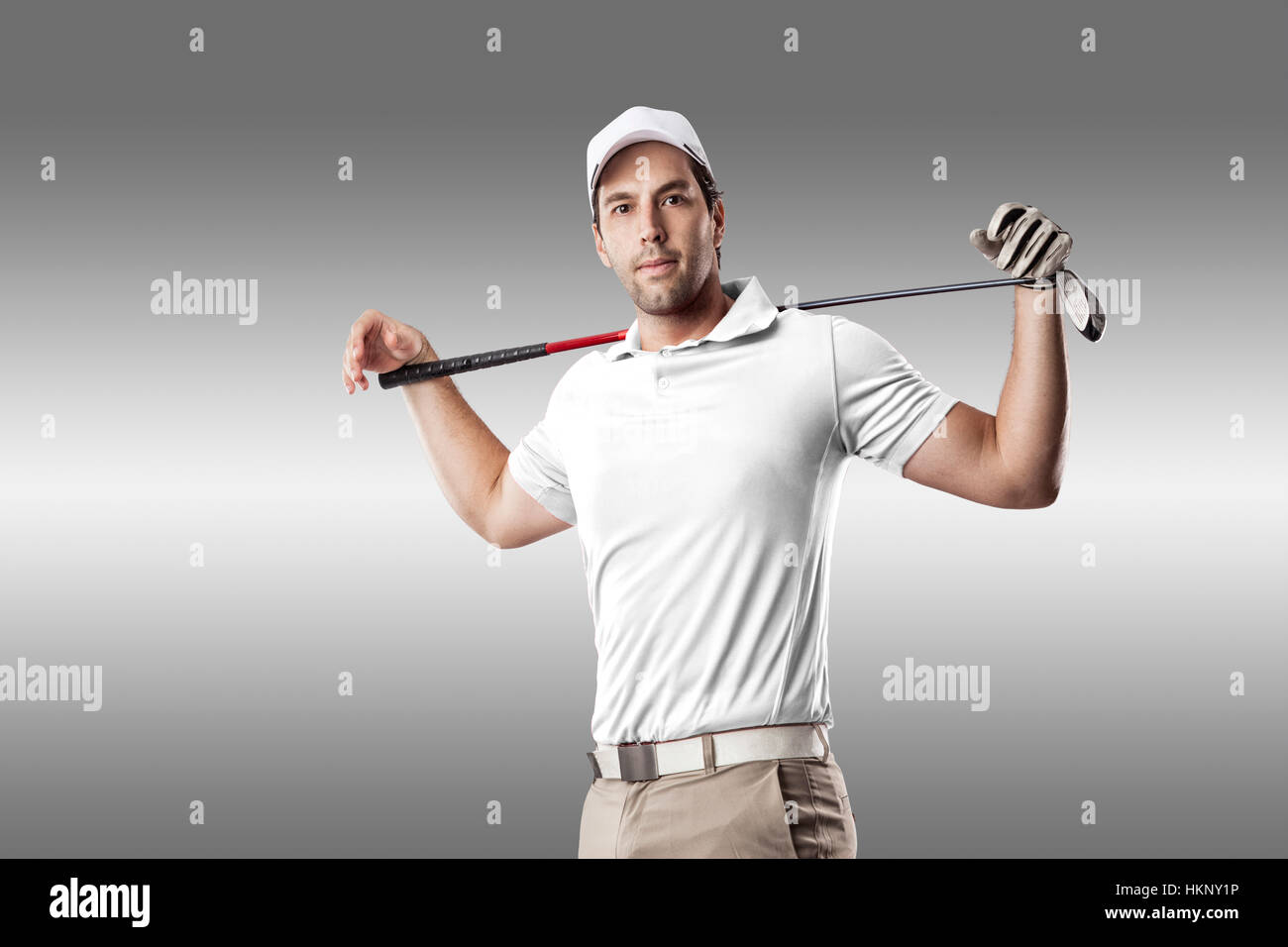 Golf Player in a white shirt taking a swing, on a white Background ...