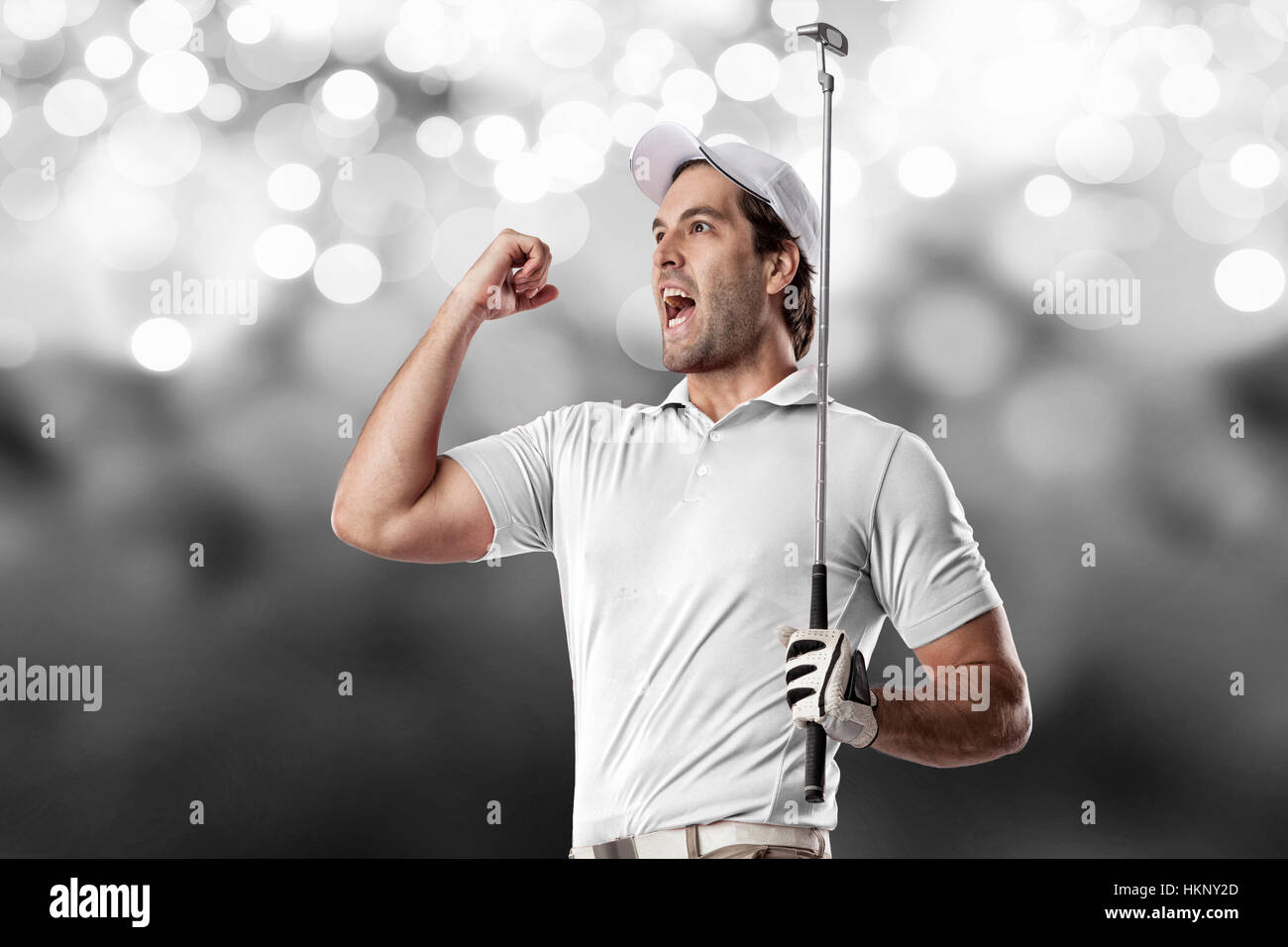 Golf Player in a white shirt celebrating, on a white lights Background ...