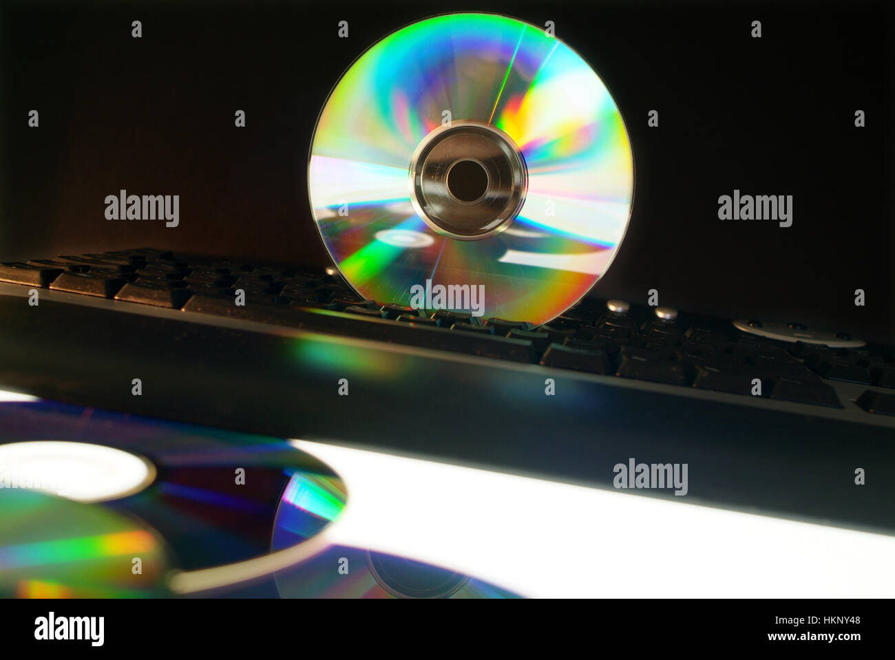 Cd rome on computer keyboard Stock Photo - Alamy