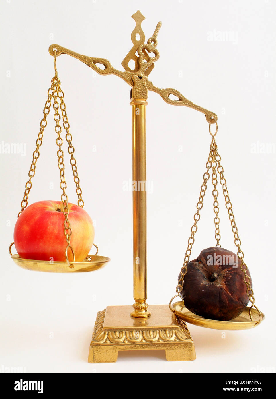 Red and rotten apple on a scale Stock Photo - Alamy