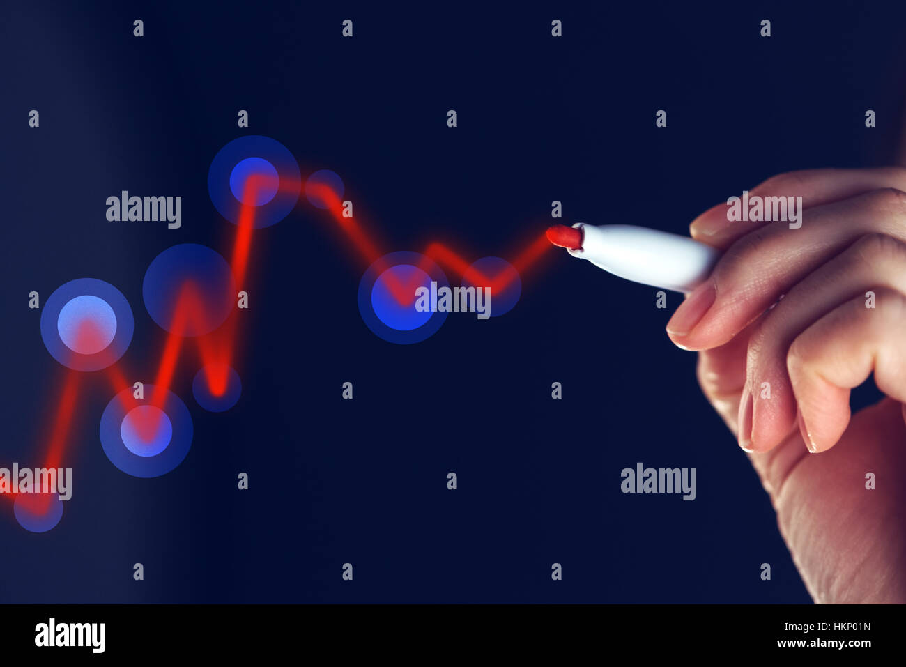 Businesswoman drawing rising graph for successful positive business ...