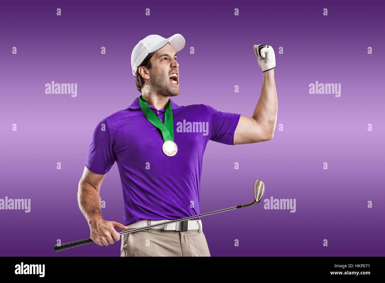 Golf Player in a purple shirt celebrating with a golden medal, on a ...