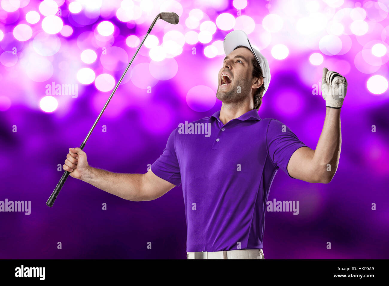 Golf Player in a purple shirt celebrating, on a purple lights ...