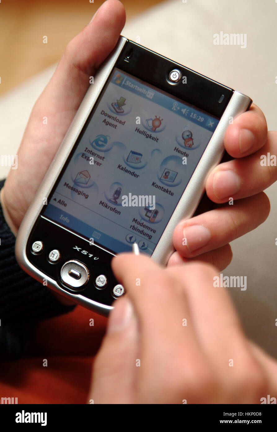 Working on a pda Stock Photo - Alamy
