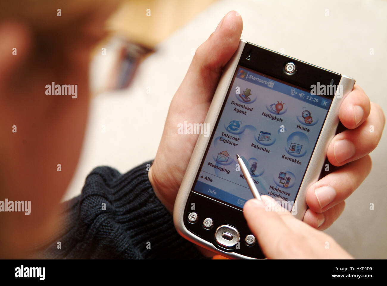 Working on a pda Stock Photo - Alamy