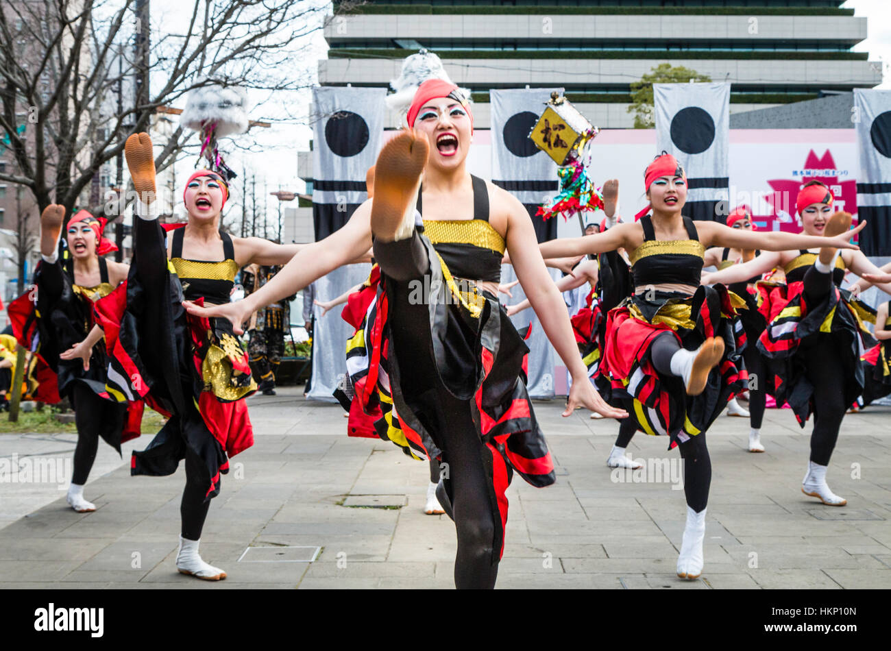 Japanese Yosakoi dance festival. Young women team, in black, gold and ...