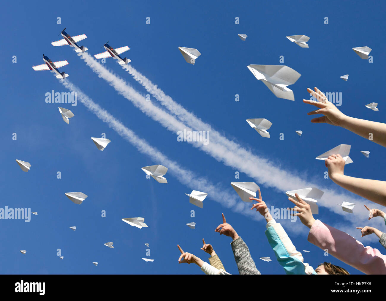 The hands of children throw upwards messages in the manner of paper ...