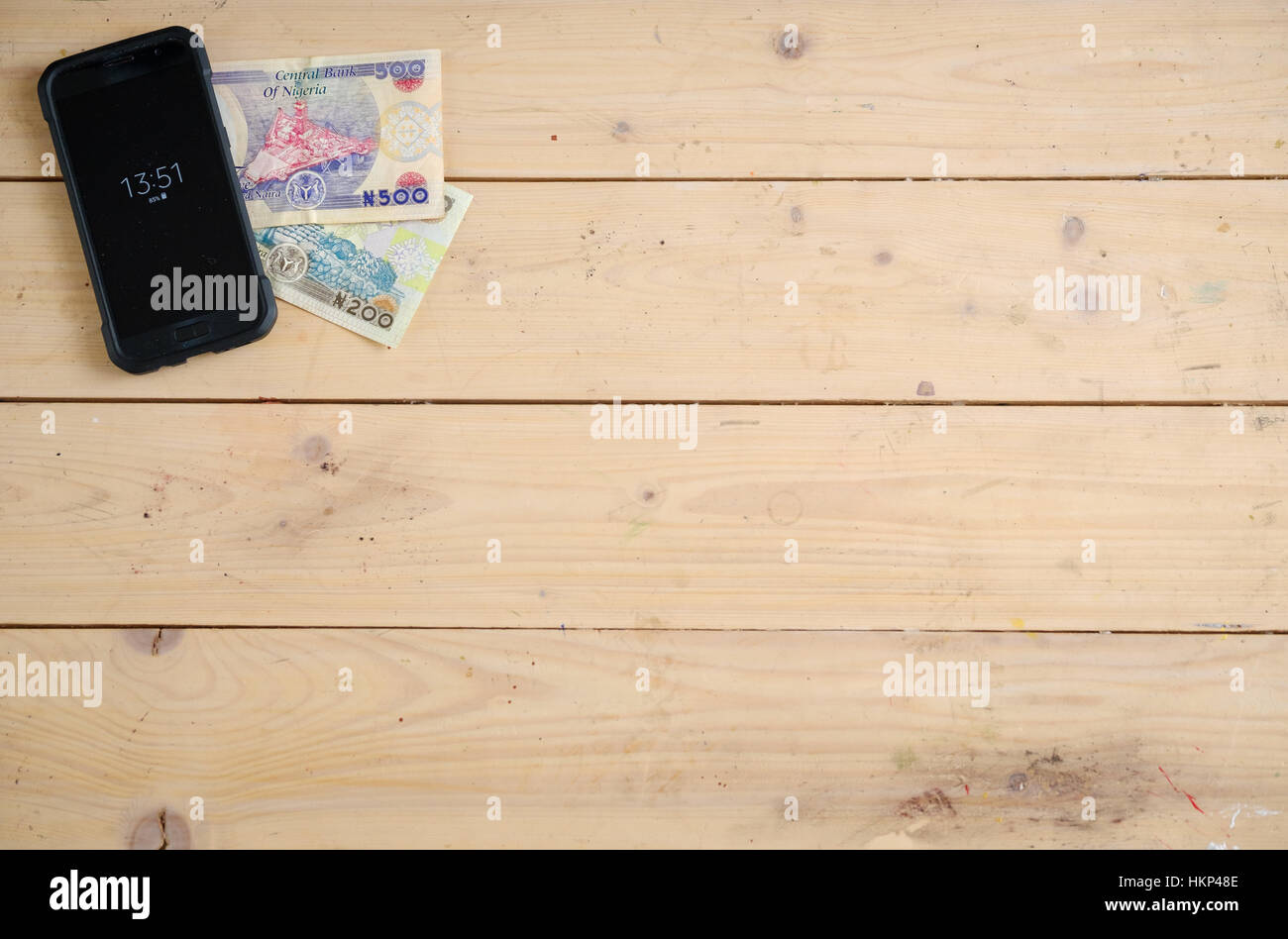 Banknotes different countries on the wooden table Stock Photo - Alamy