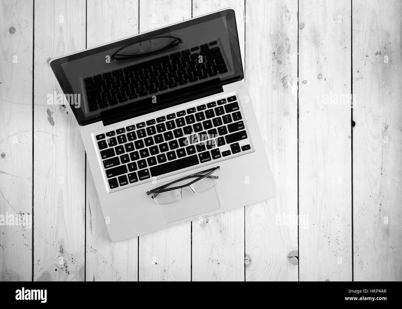 Wooden desk with various gadgets and accessories Stock Photo - Alamy