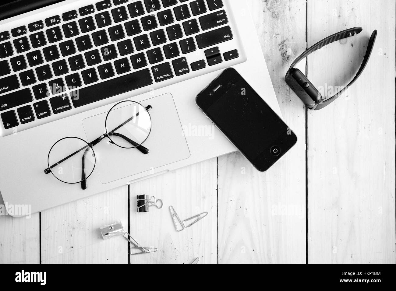 Wooden desk with various gadgets and accessories Stock Photo - Alamy