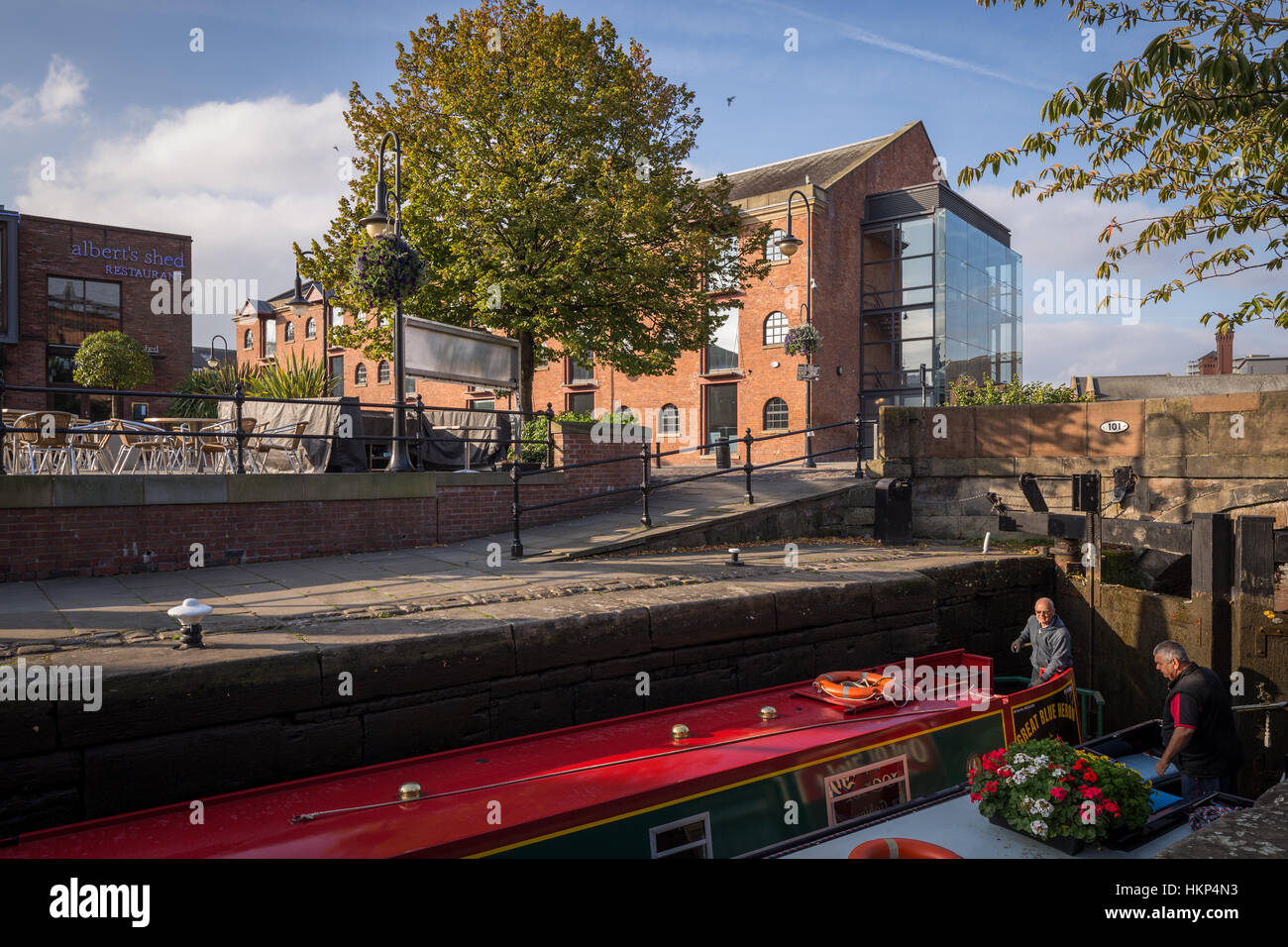 Merchants Warehouse, Castlefield, Manchester with canal lock and barge ...