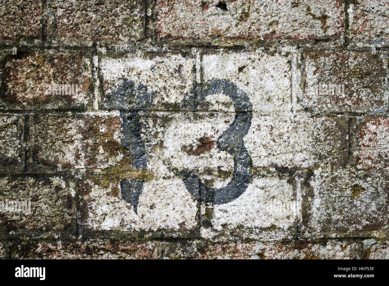 Number 13 painted on brick wall Stock Photo - Alamy