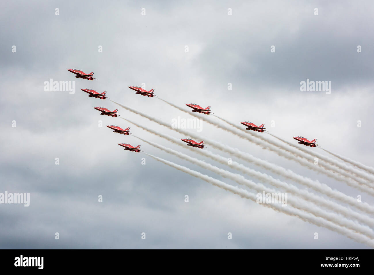 Red arrows with smoke trails hi-res stock photography and images - Alamy