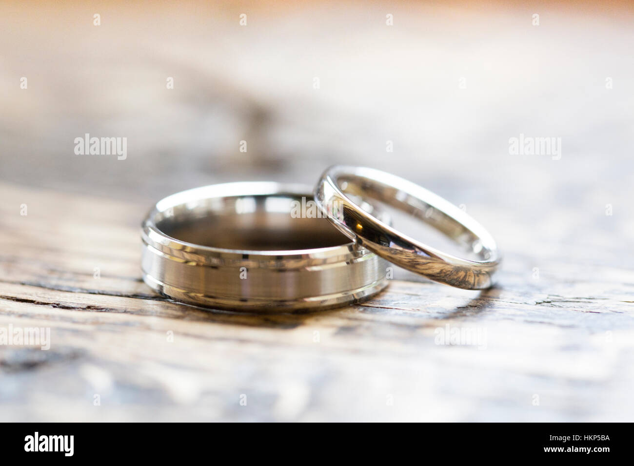 Wedding rings on wooden surface hi-res stock photography and images - Alamy