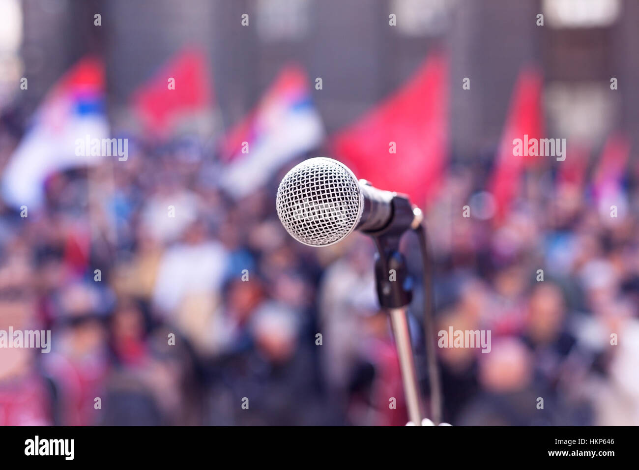 Microphone in focus against blurred crowd Stock Photo - Alamy