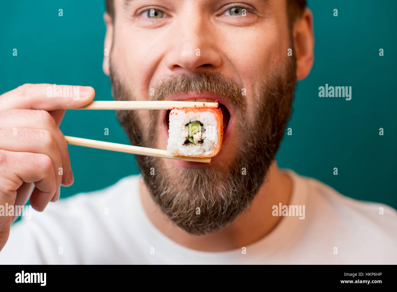 Man with sushi Stock Photo - Alamy
