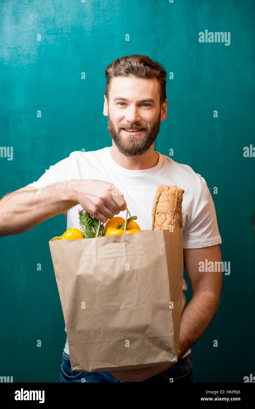 Man with bag full of food Stock Photo - Alamy