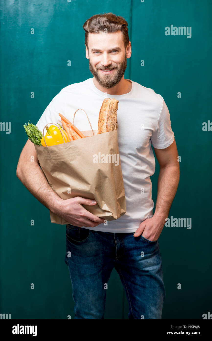 Man with groceries bag hi-res stock photography and images - Alamy