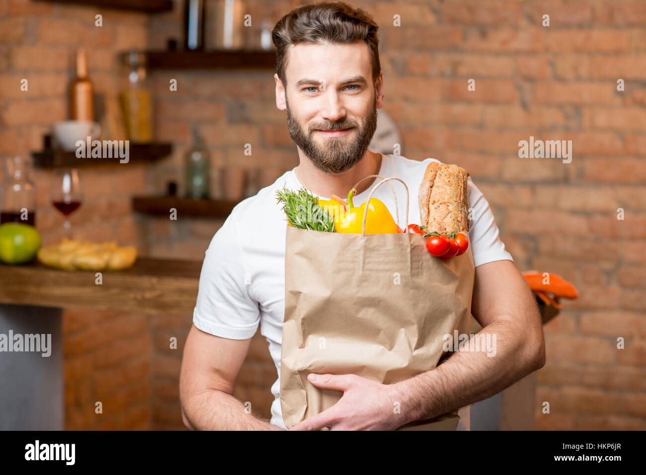 Man with bag full of food Stock Photo - Alamy