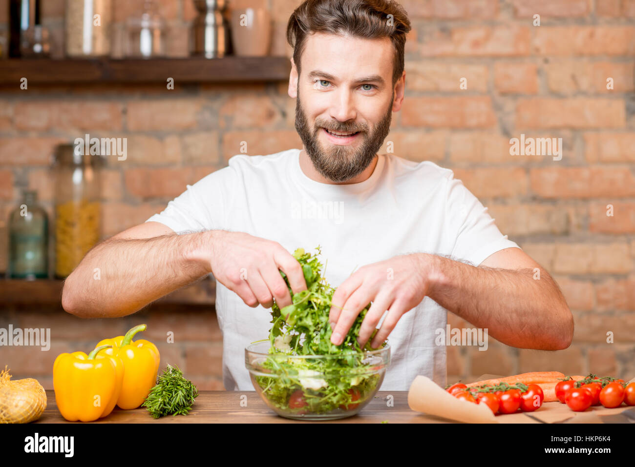 Man kitchen making salad food person fresh green hi-res stock ...