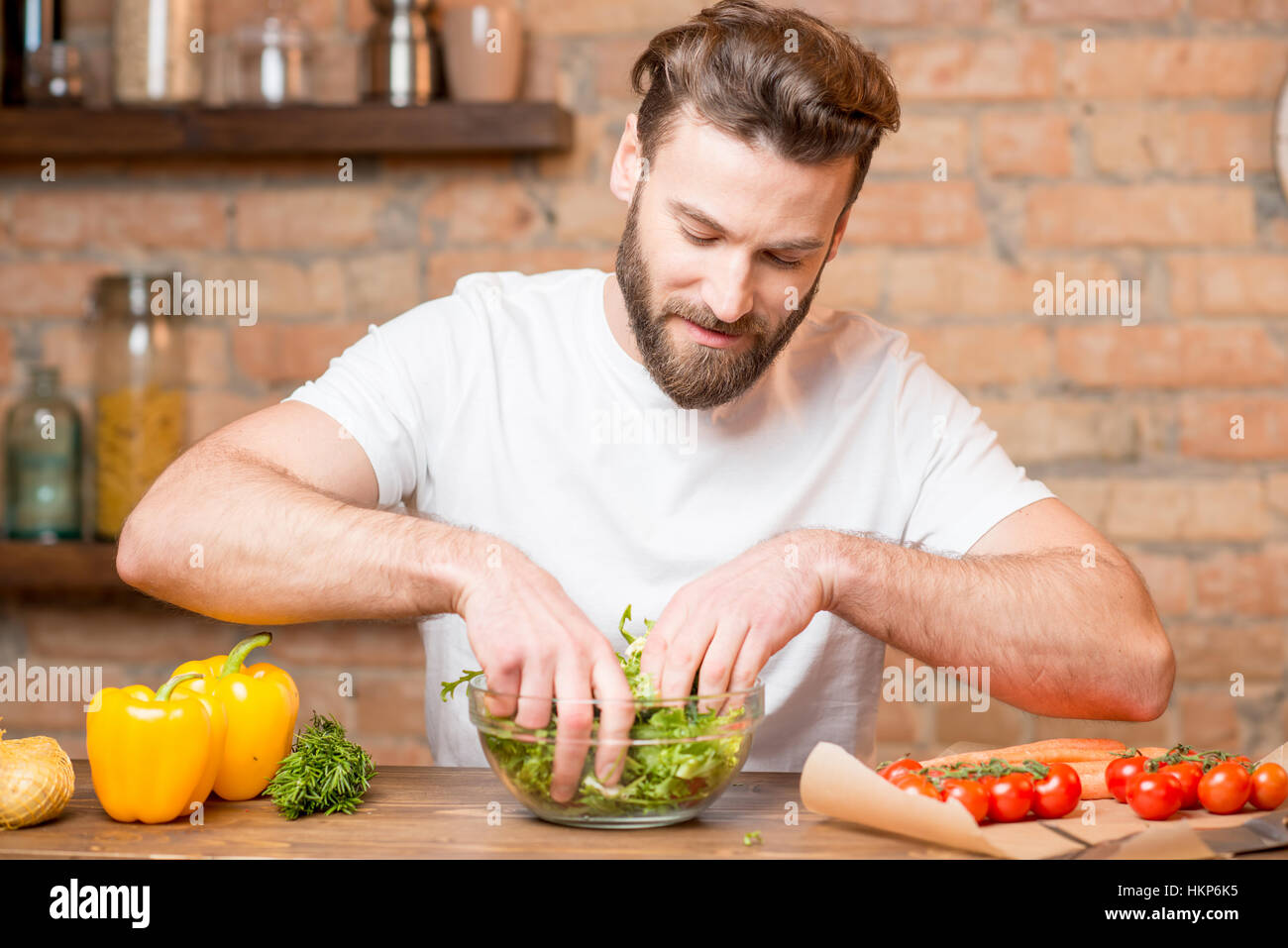 Man making salad Stock Photo - Alamy