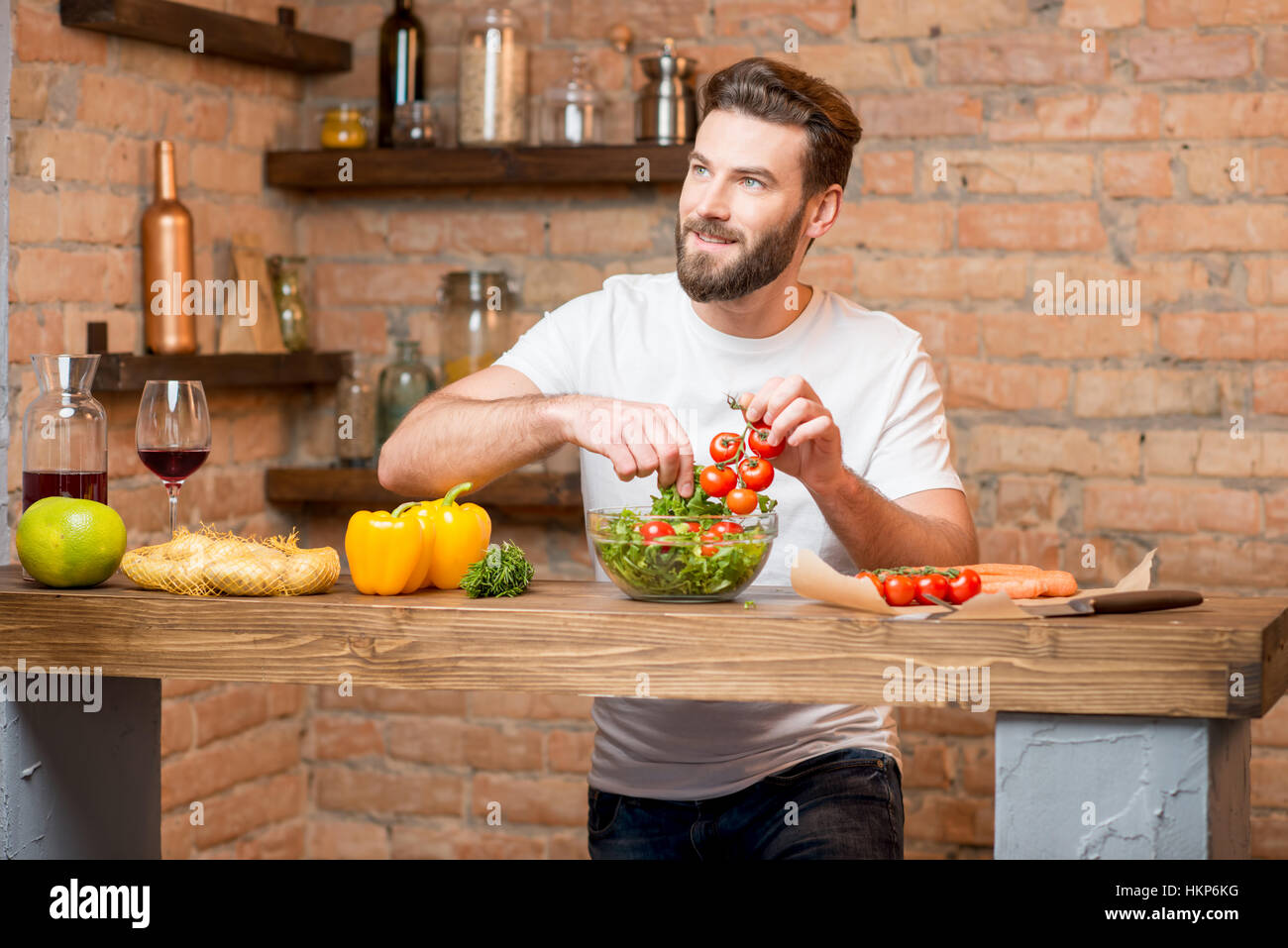 Man making salad Stock Photo - Alamy