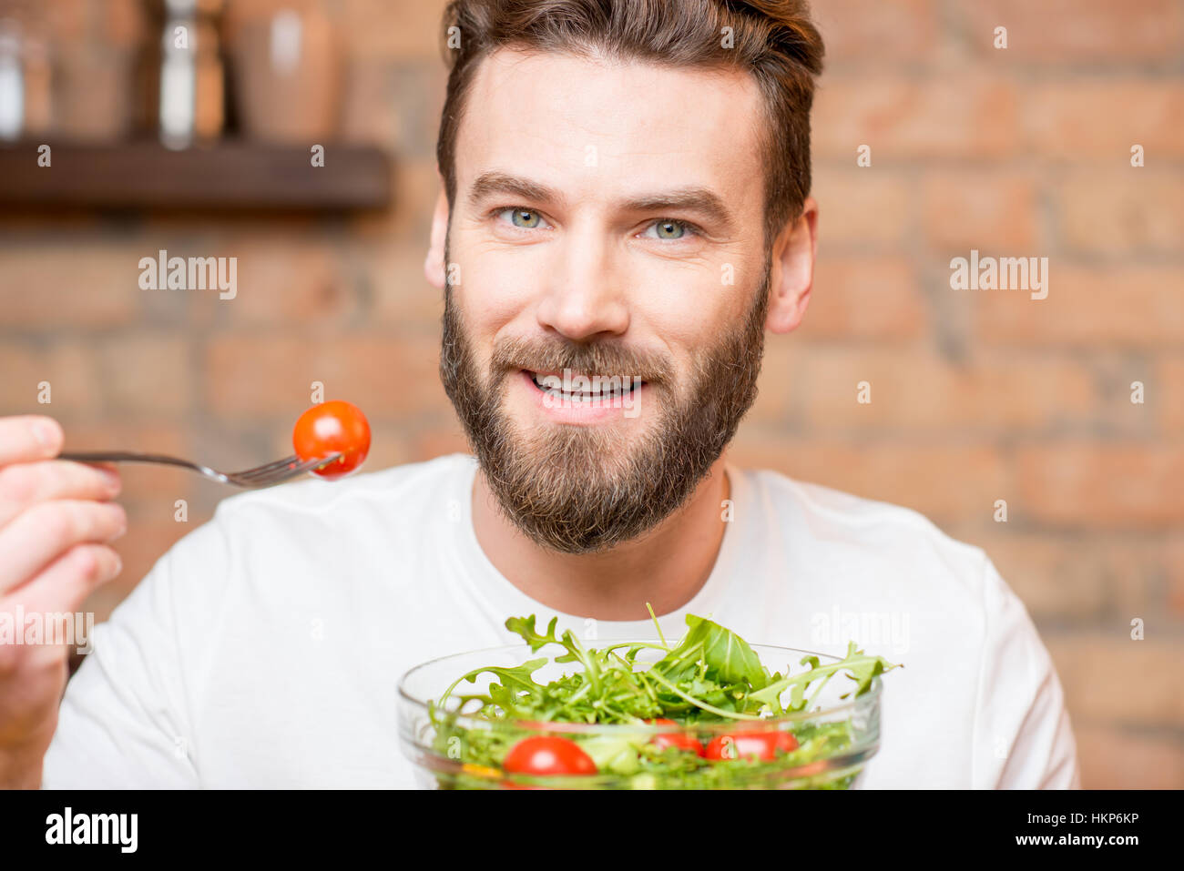 Man with salad Stock Photo - Alamy