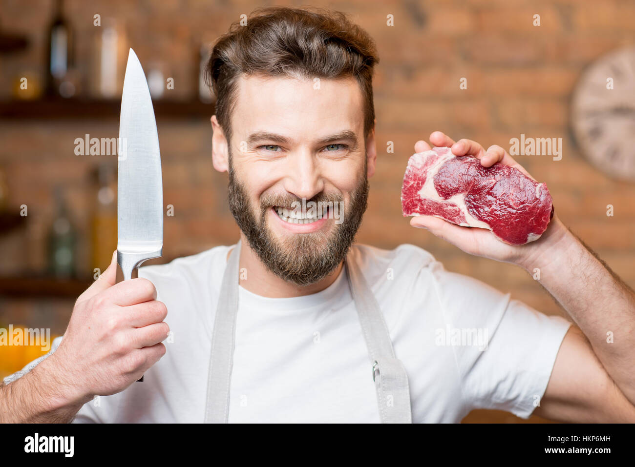 Man with meat Stock Photo - Alamy