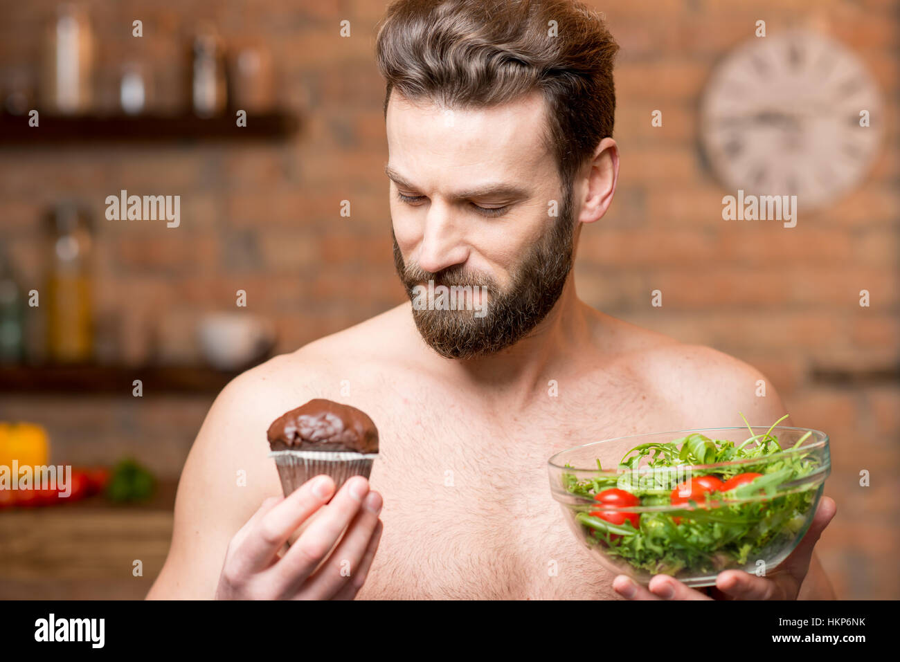 Man with food in the kitchen Stock Photo - Alamy