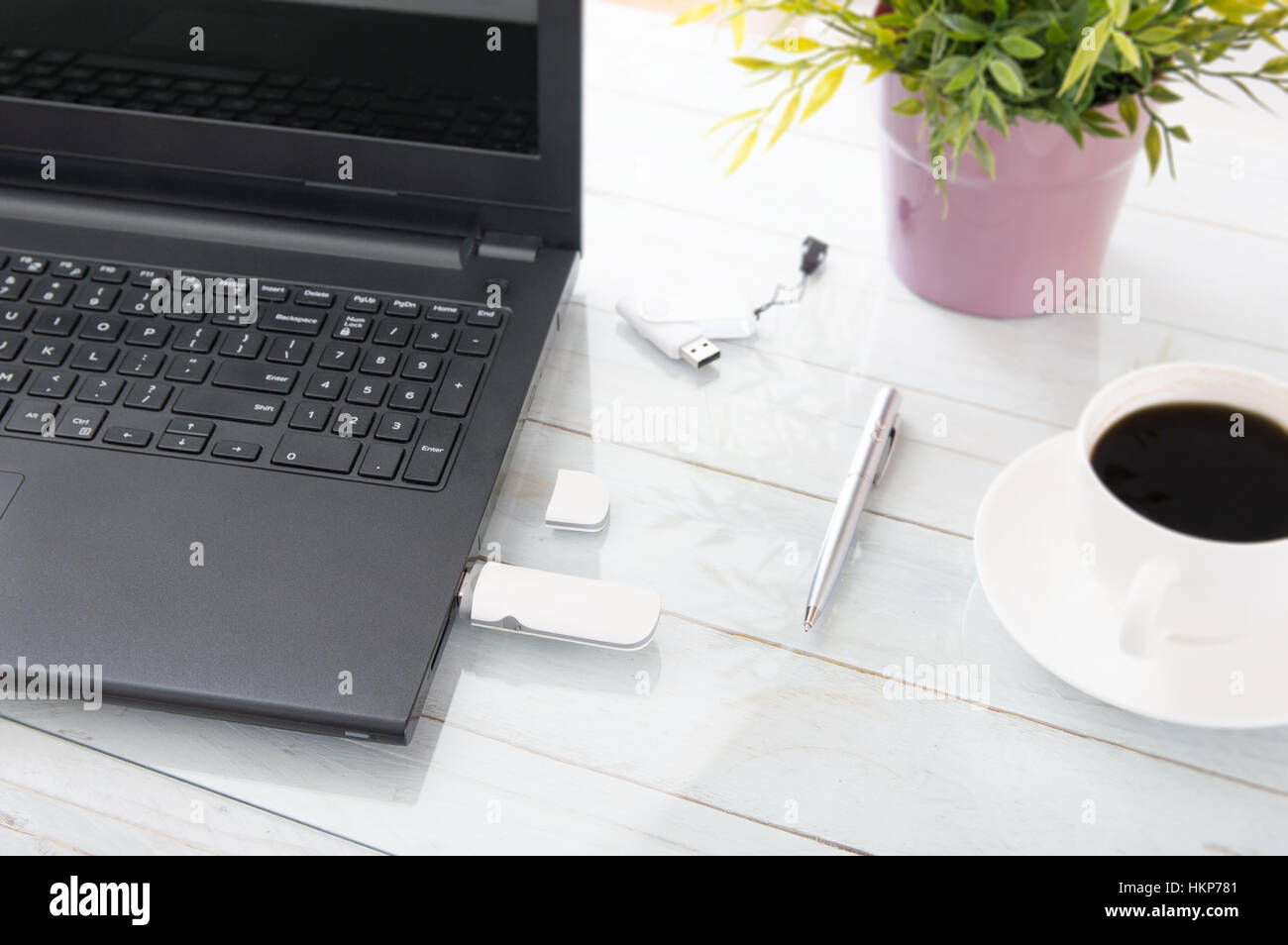 White GSM modem plugged in a laptop Stock Photo - Alamy