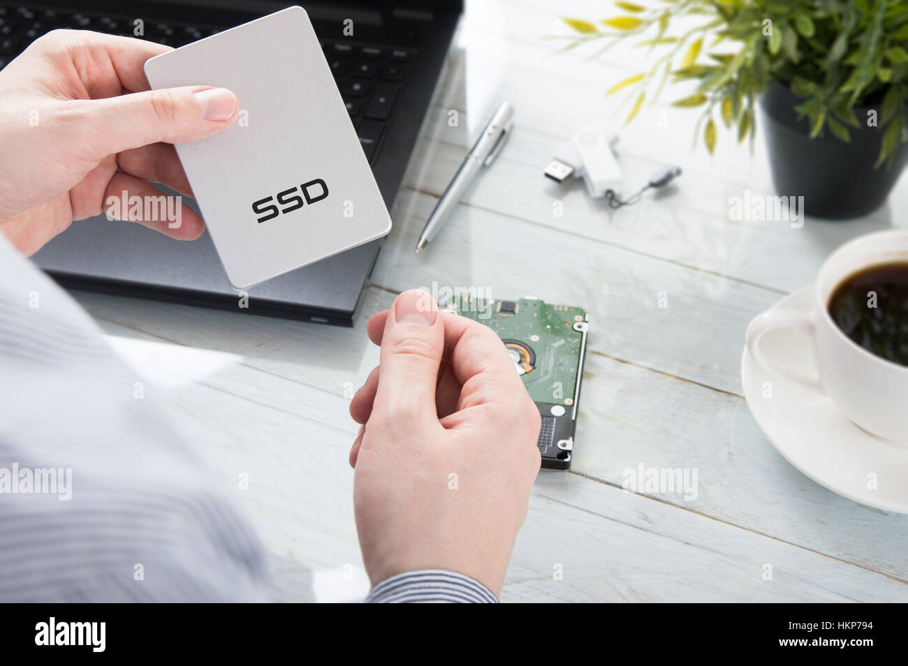 Man is holding modern SSD disk Stock Photo - Alamy